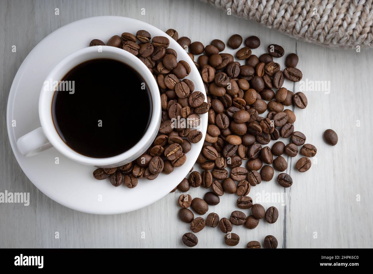 a cup of coffee on a bale of hay, with leaves and a cloth Stock Photo ...