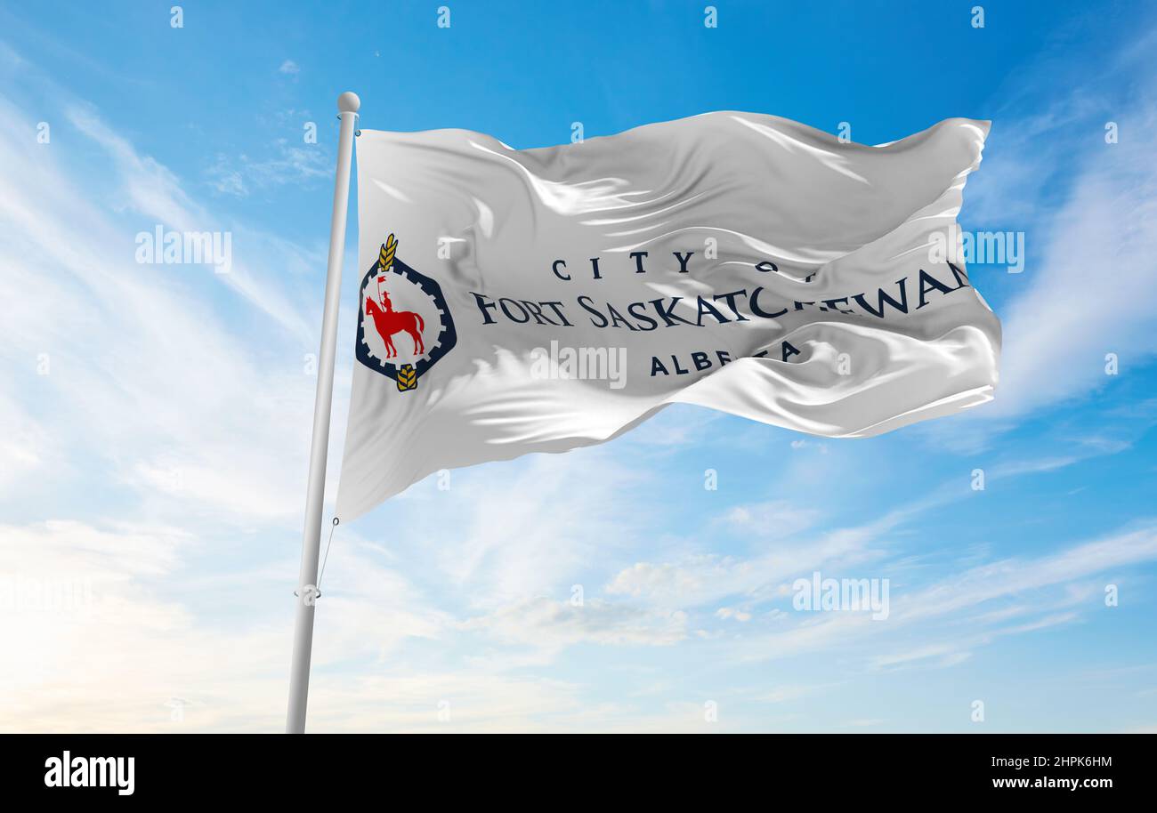 flag of Fort Saskatchewan , Canada at cloudy sky background on sunset ...