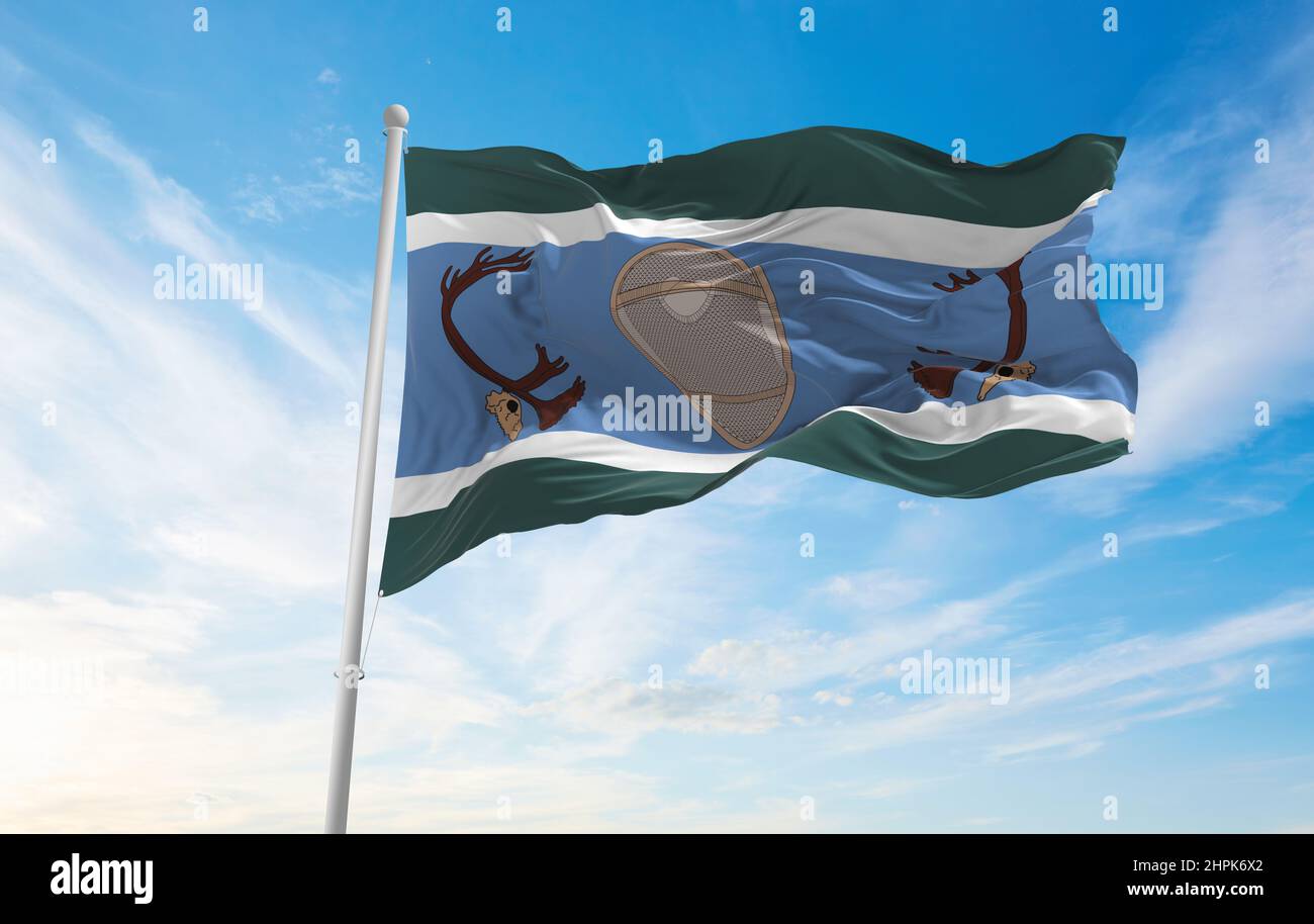 flag of Innu Nation , Canada at cloudy sky background on sunset ...