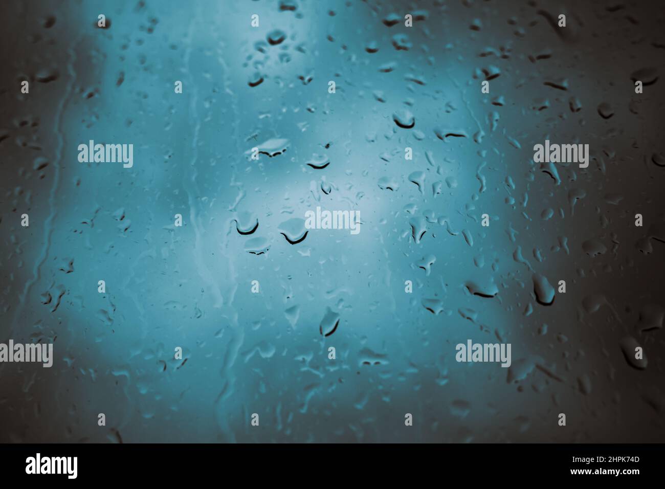 Moody background. Raindrops on the window with moody effect. Weather or ...