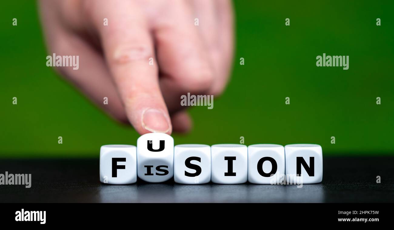 Symbol for the change to nuclear fusion. Hand turns dice and changes ...