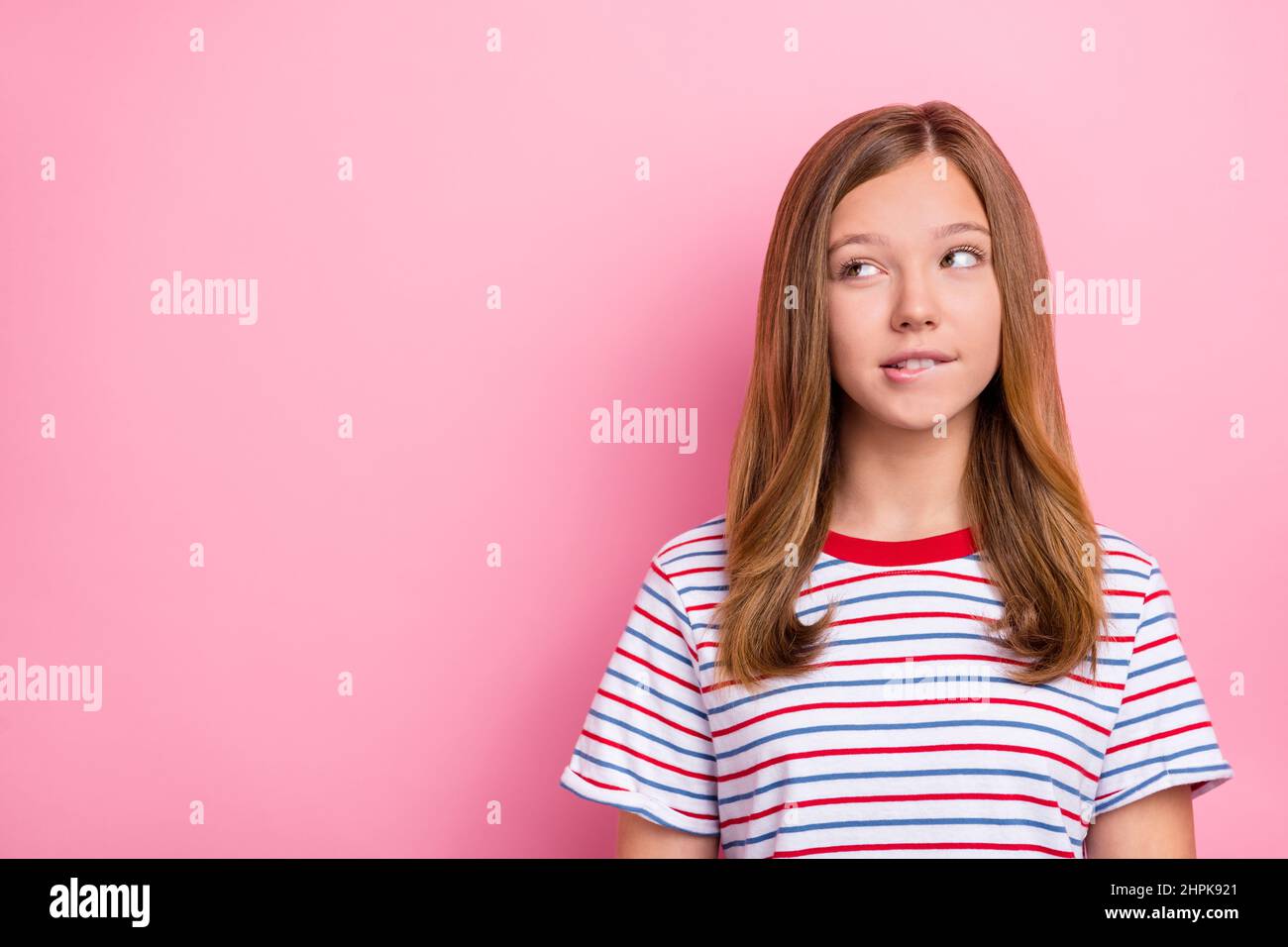 Photo of cunning little girl look promo wear red t-shirt isolated on ...