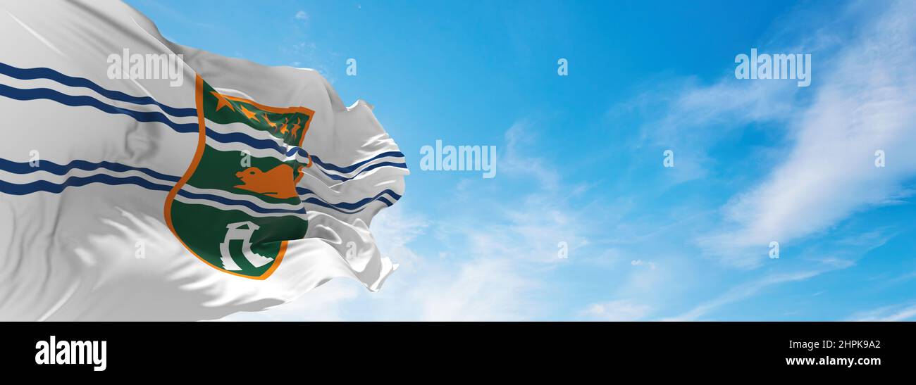 flag of Surrey British Columbia , Canada at cloudy sky background on ...