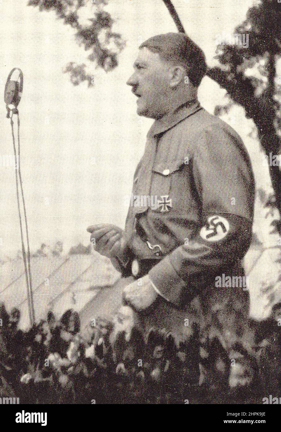 Adolf Hitler in front of a microphone. The Fuhrer speaks to the youth ...