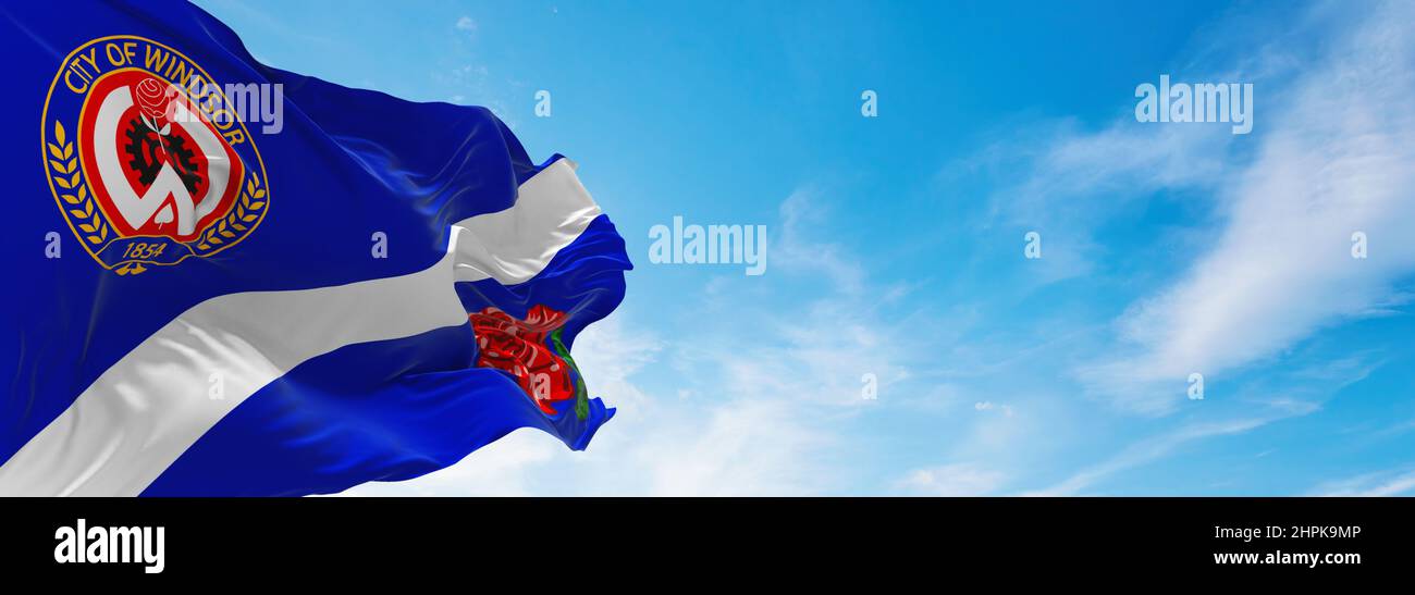 flag of Windsor, Ontario , Canada at cloudy sky background on sunset ...