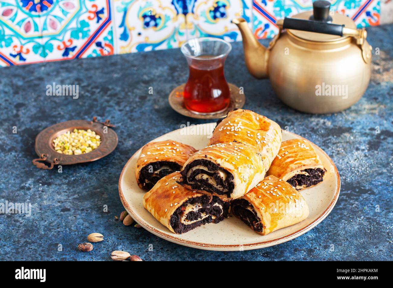 Traditional turkish pastry roll with chocolate and nuts filling in a ...