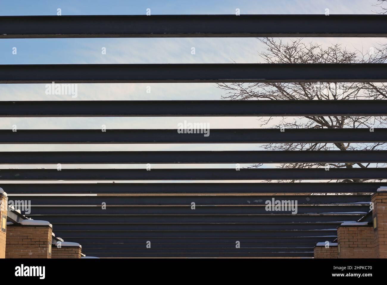 Steel beams running overhead as a type of minimalist cover Stock Photo ...