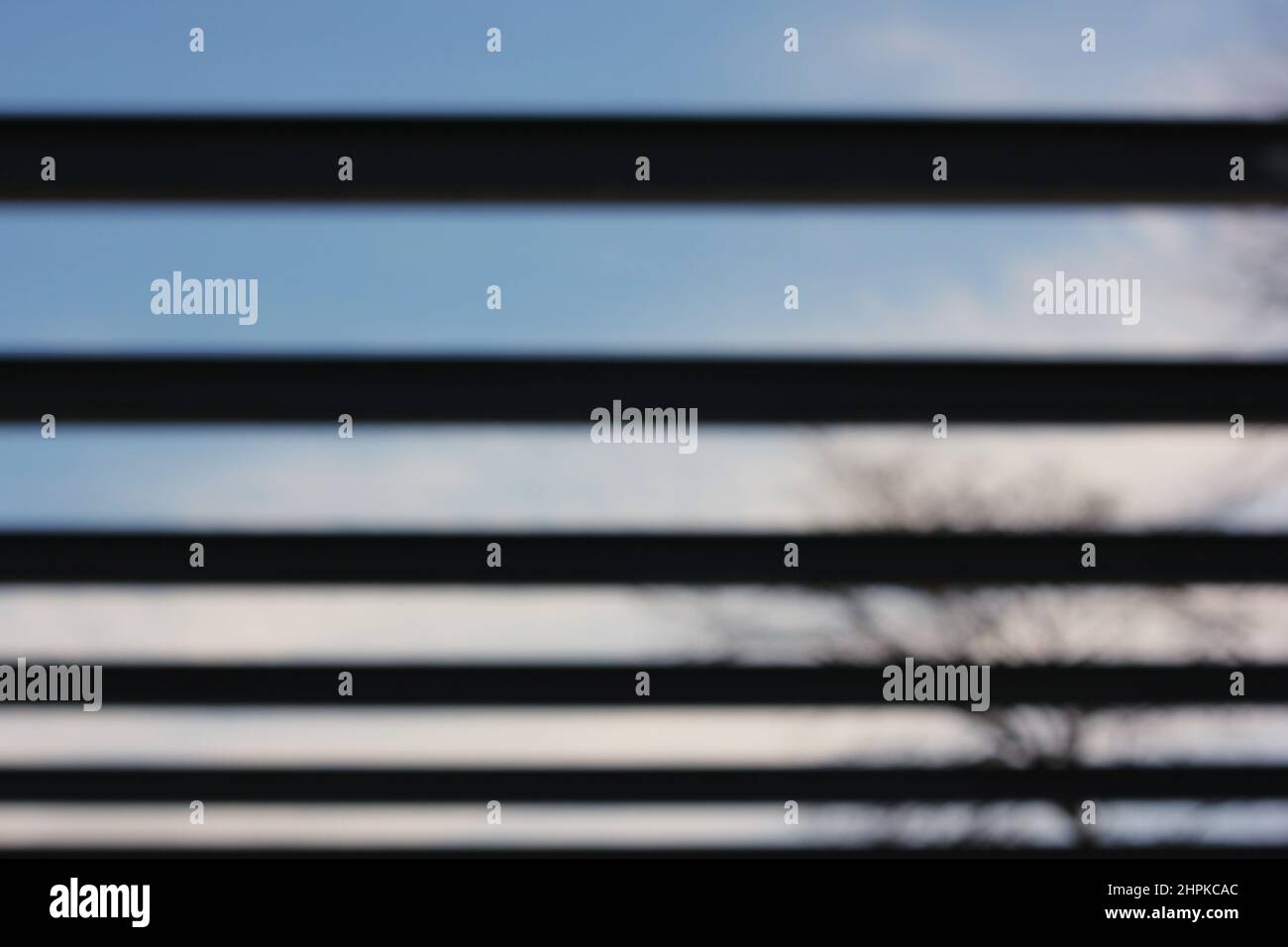 Dreamy view of many parallel overhead horizontal steel beams set ...