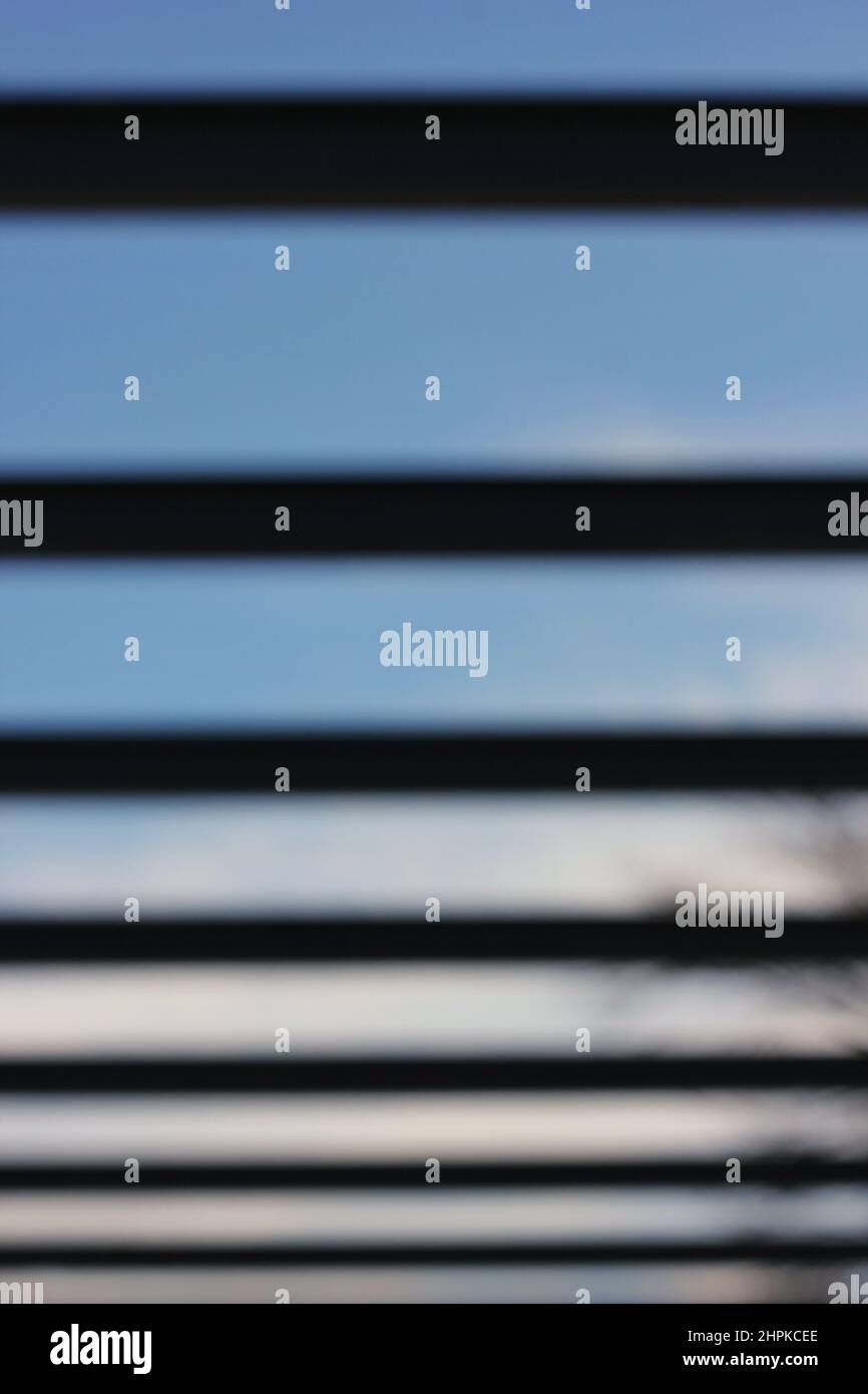 Dreamy view of many parallel overhead horizontal steel beams set ...