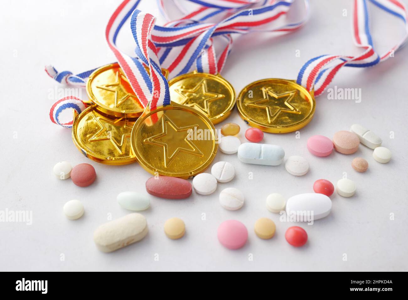 First Place Throphy and medical pills on white background Stock Photo ...