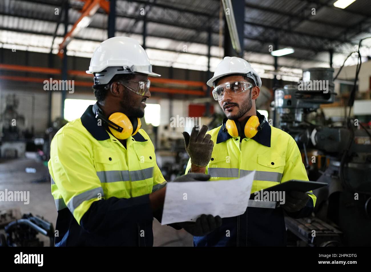 Factory Engineer Operating machines in industry factory Stock Photo - Alamy