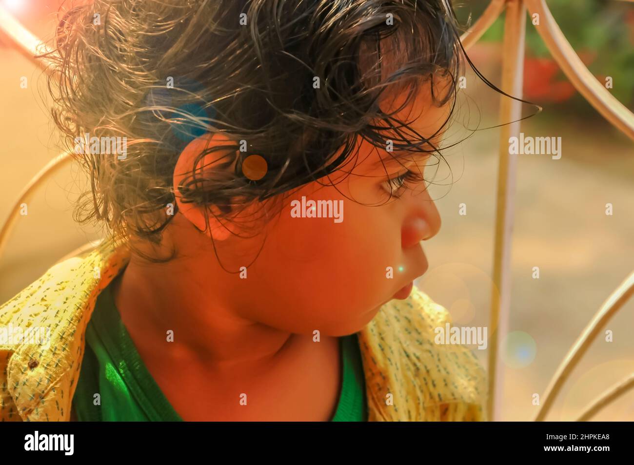 A portrait of an East Indian baby boy / child / kid with an unbuttoned ...
