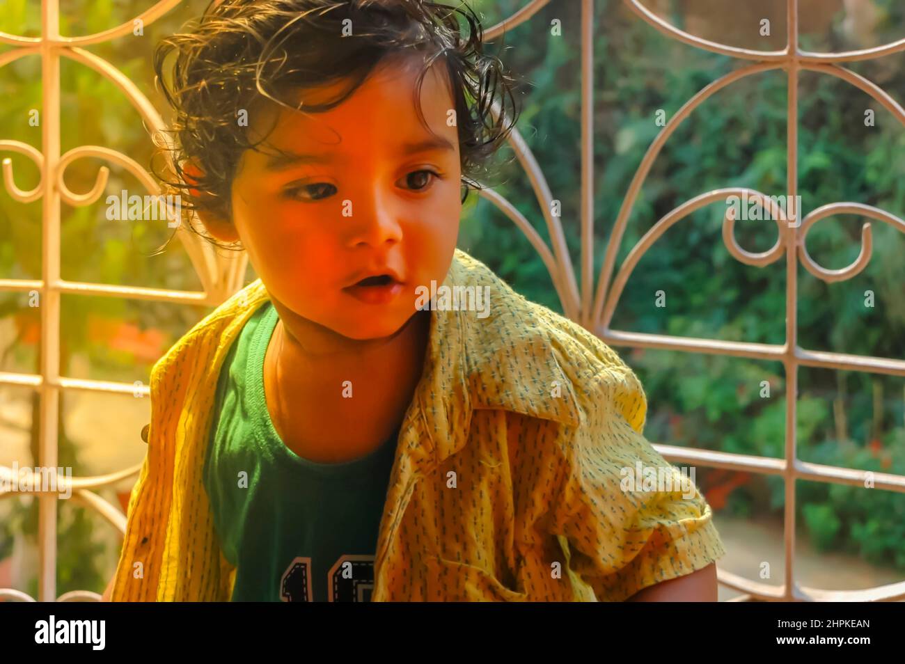 A portrait of an East Indian baby boy / child / kid with mouth agape ...