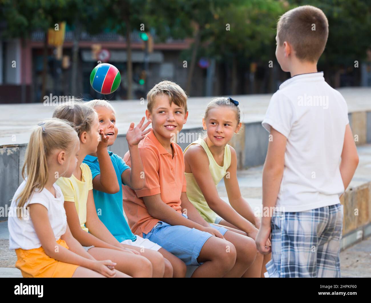 children playing with small ball outdoor Stock Photo - Alamy