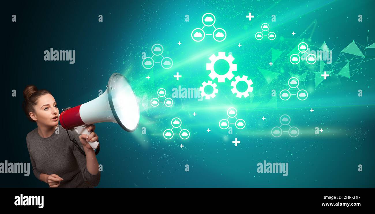Young person with megaphone and technology related icon Stock Photo - Alamy