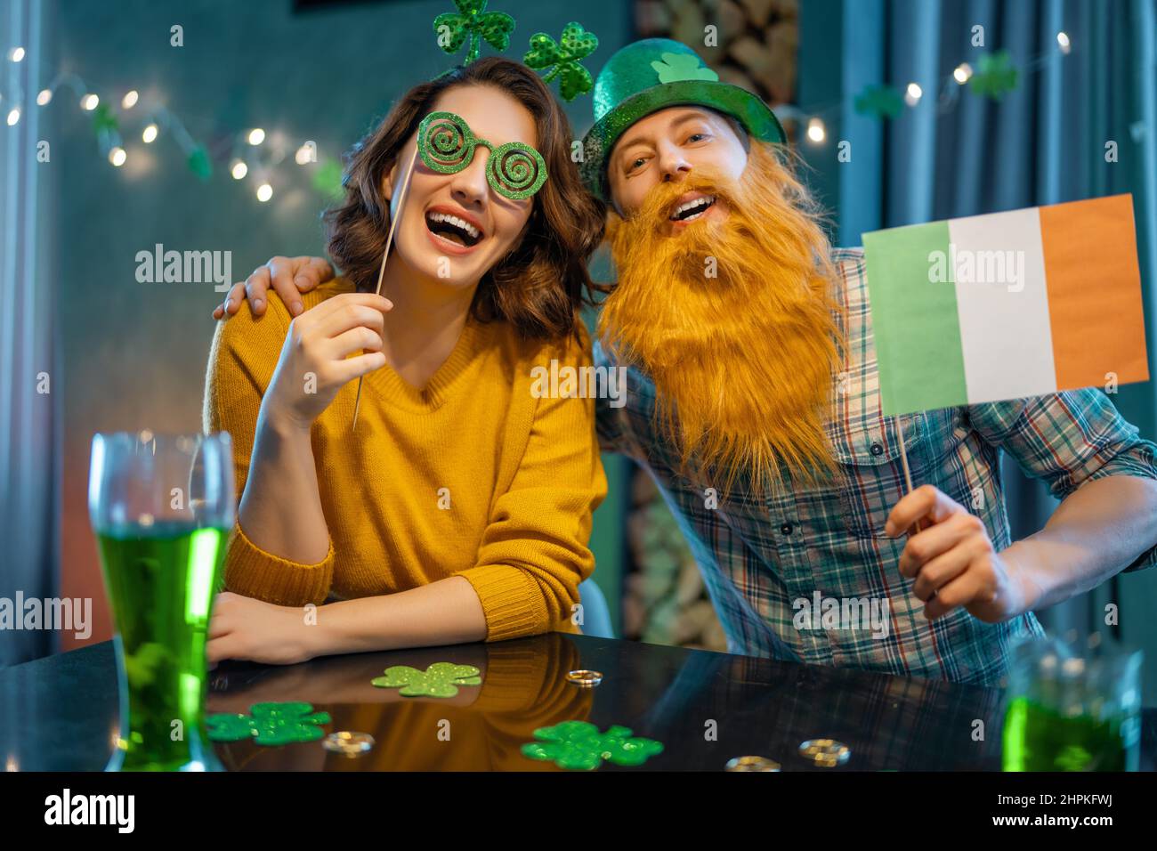 Happy family couple celebrating St. Patrick's Day Stock Photo - Alamy