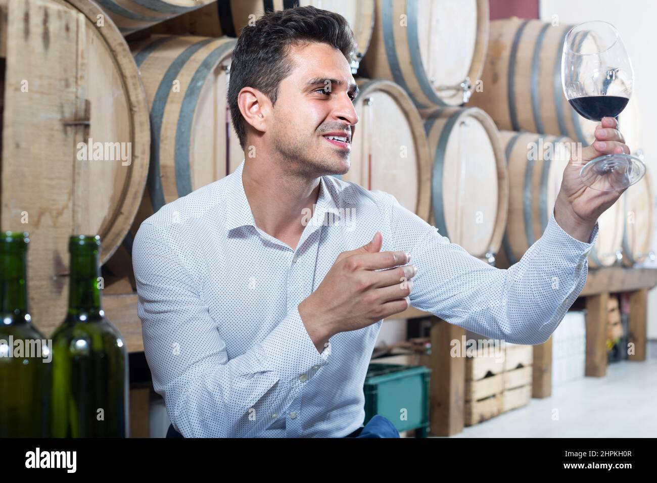 man tasting wine in cellar Stock Photo - Alamy