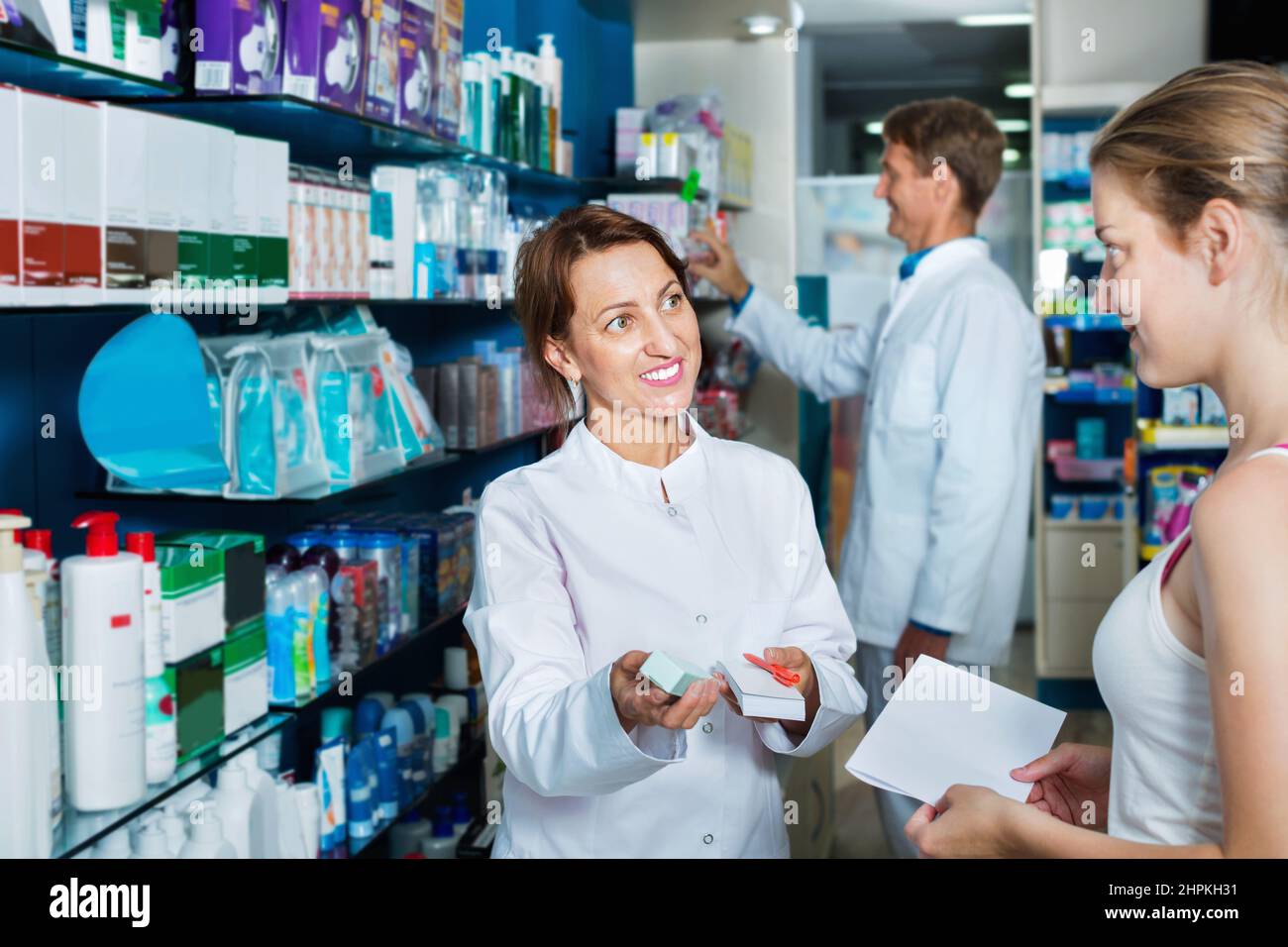 Girl wearing chemist uniform hi-res stock photography and images - Alamy