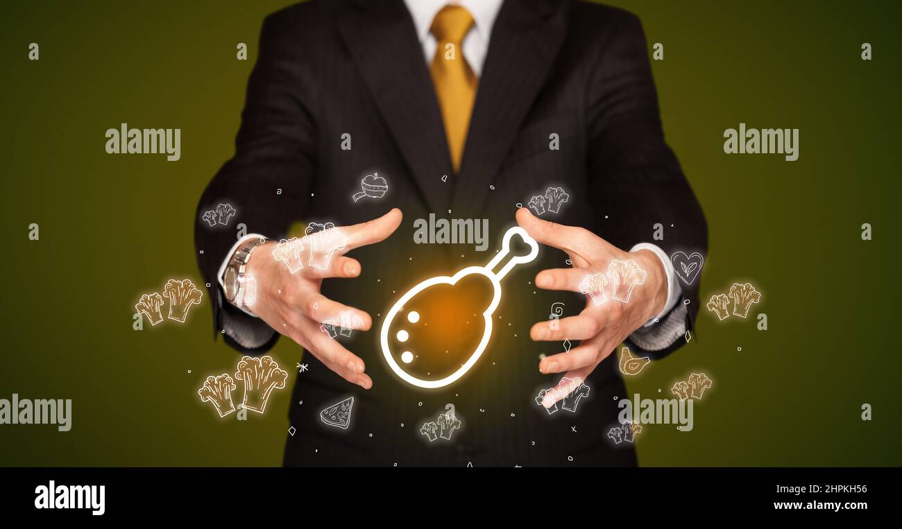 Hand holding food related icons Stock Photo - Alamy
