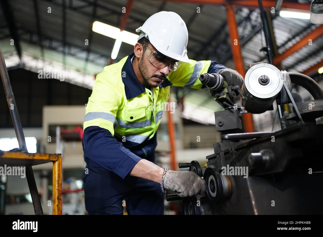 Factory Engineer Operating machines in industry factory Stock Photo - Alamy