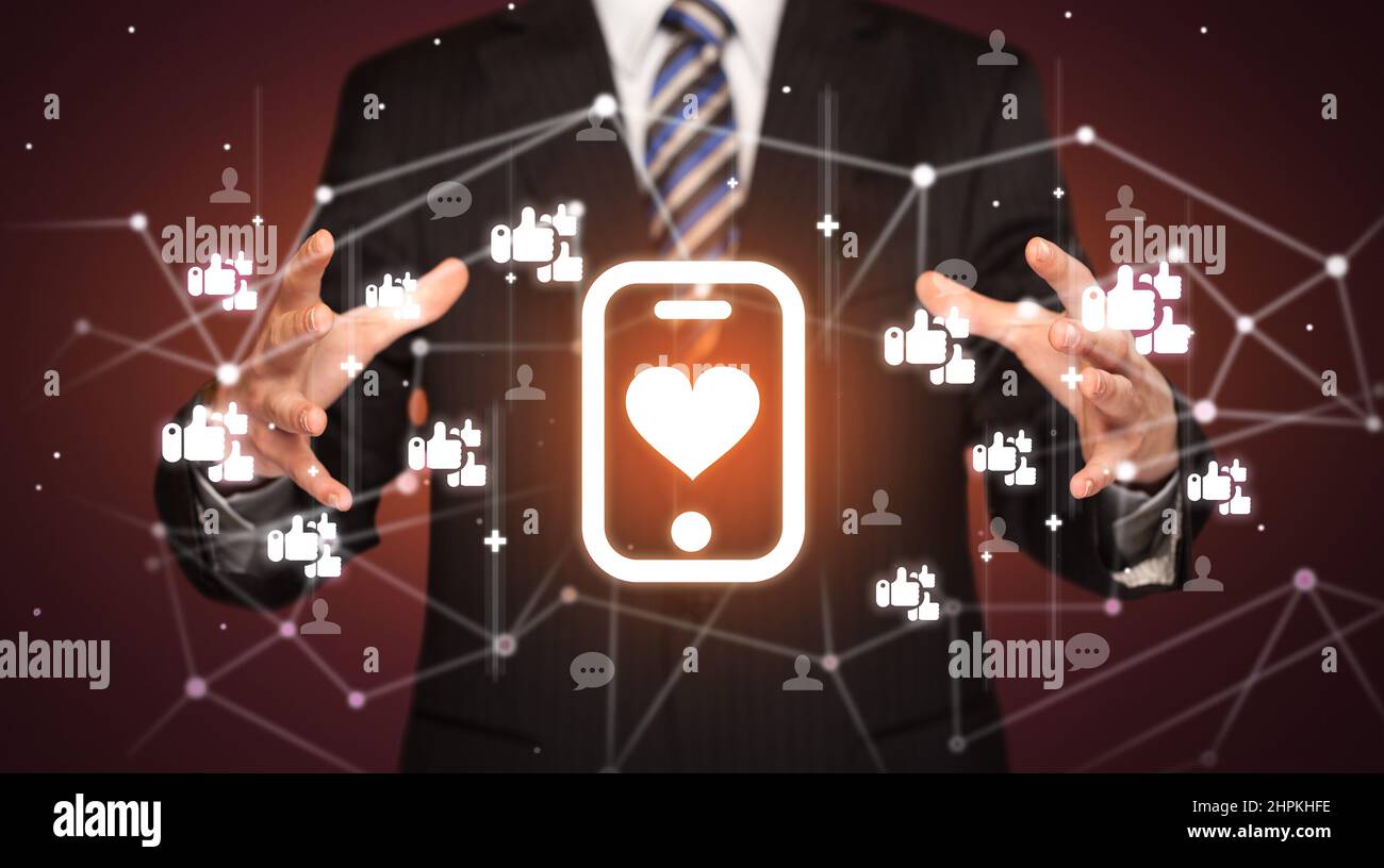Hand holding social media icons concept Stock Photo - Alamy