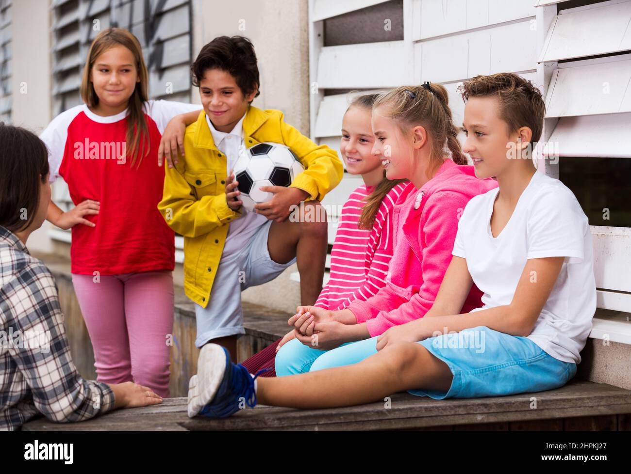 boys and girls are communicating outdoor Stock Photo - Alamy