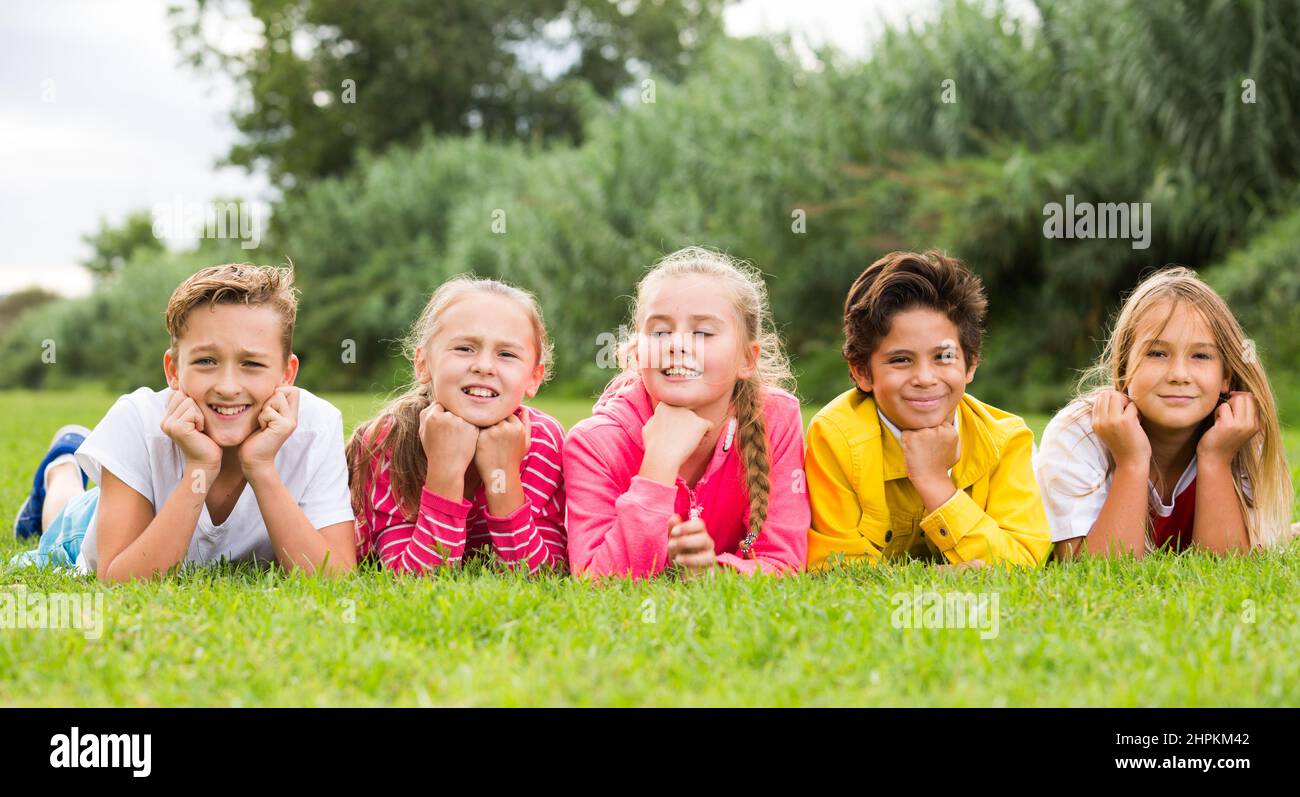 Portrait of children who are posing lying Stock Photo - Alamy