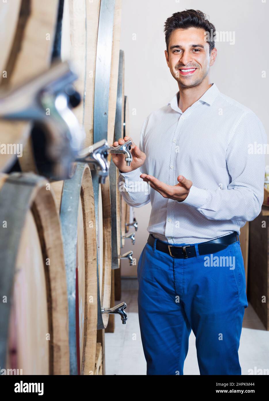Man customer standing in winery store with woods Stock Photo - Alamy