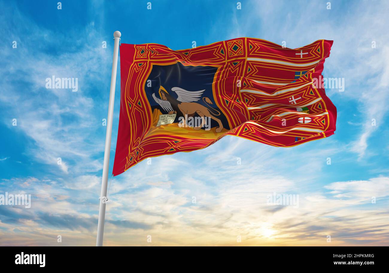flag of Veneto, Italy at cloudy sky background on sunset, panoramic ...