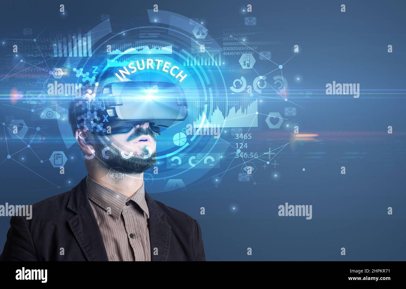 Businessman looking through VR glasses Stock Photo - Alamy