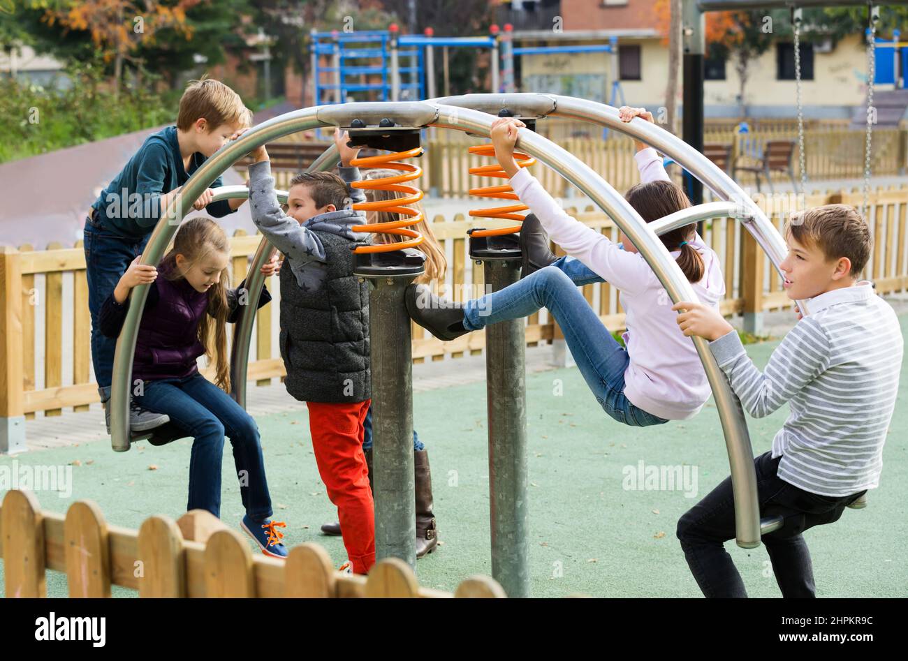 Excited girl on swing holding hi-res stock photography and images - Alamy