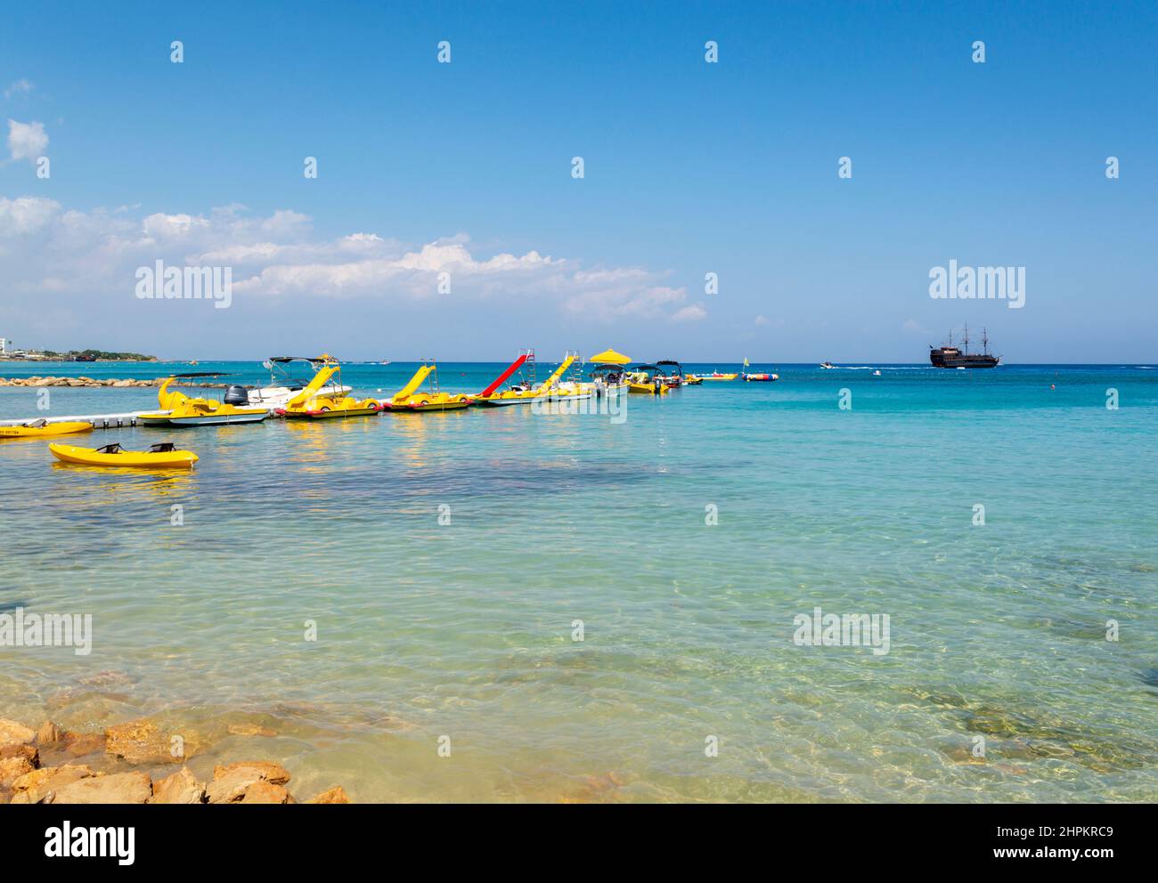 Crystal clear blue water of Mediterranean sea on white sandy Fig tree ...