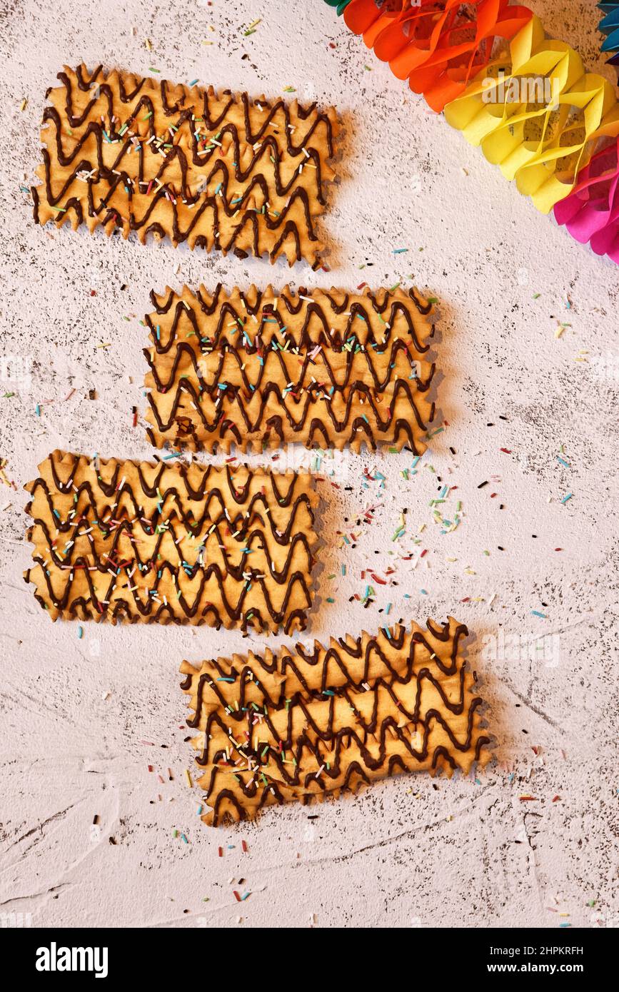 Traditional Italian Chiacchere for Carnival with choco topping and ...