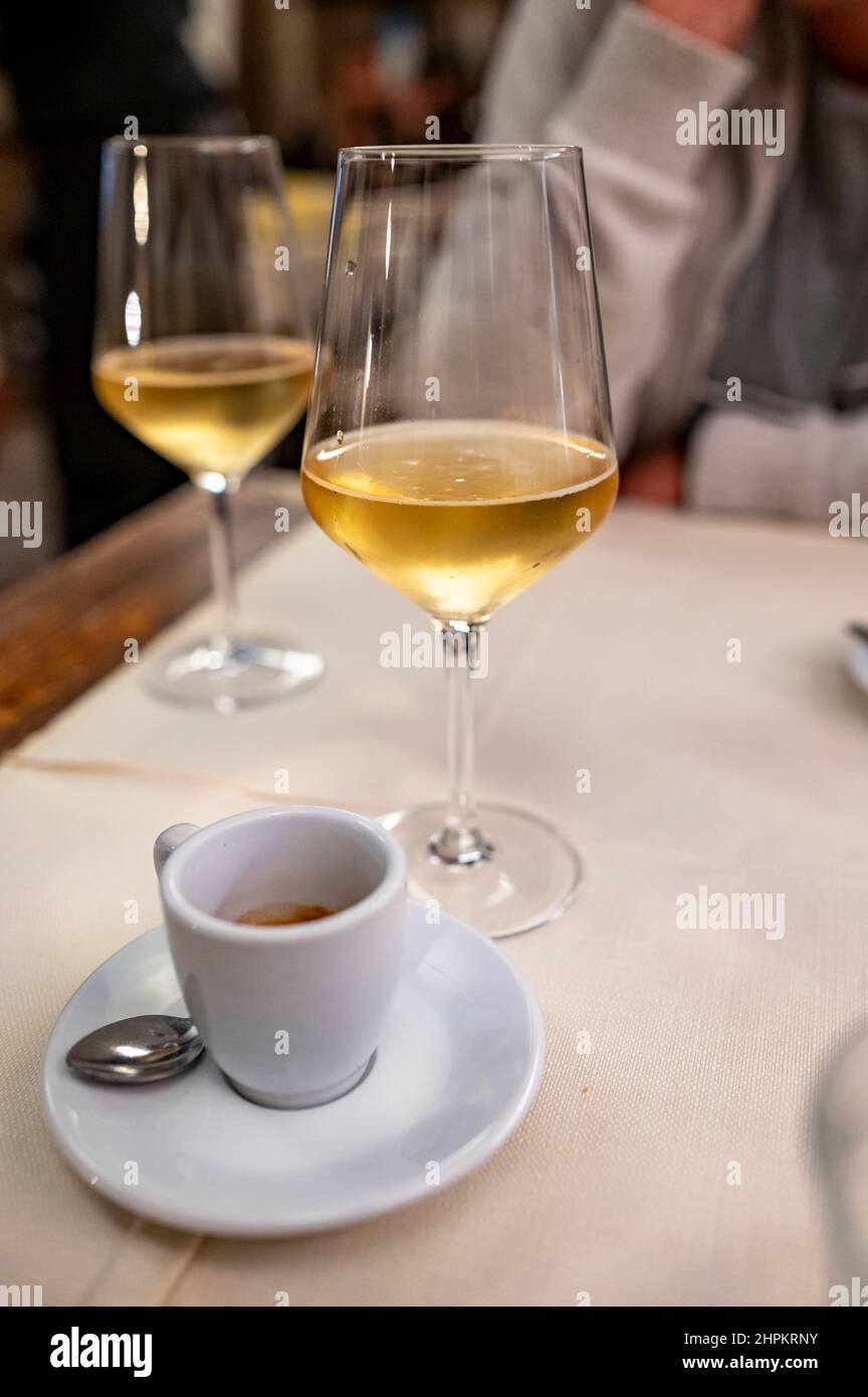 Dinner with sweet cold muscat white desert wine in traditional Italian ...