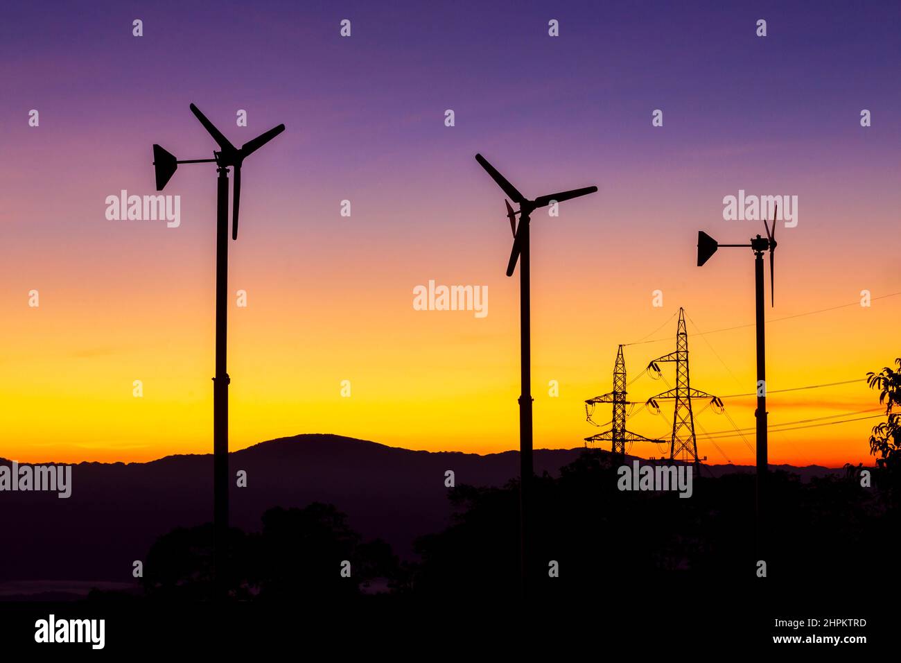 Wind turbine power generator at twilight Stock Photo - Alamy