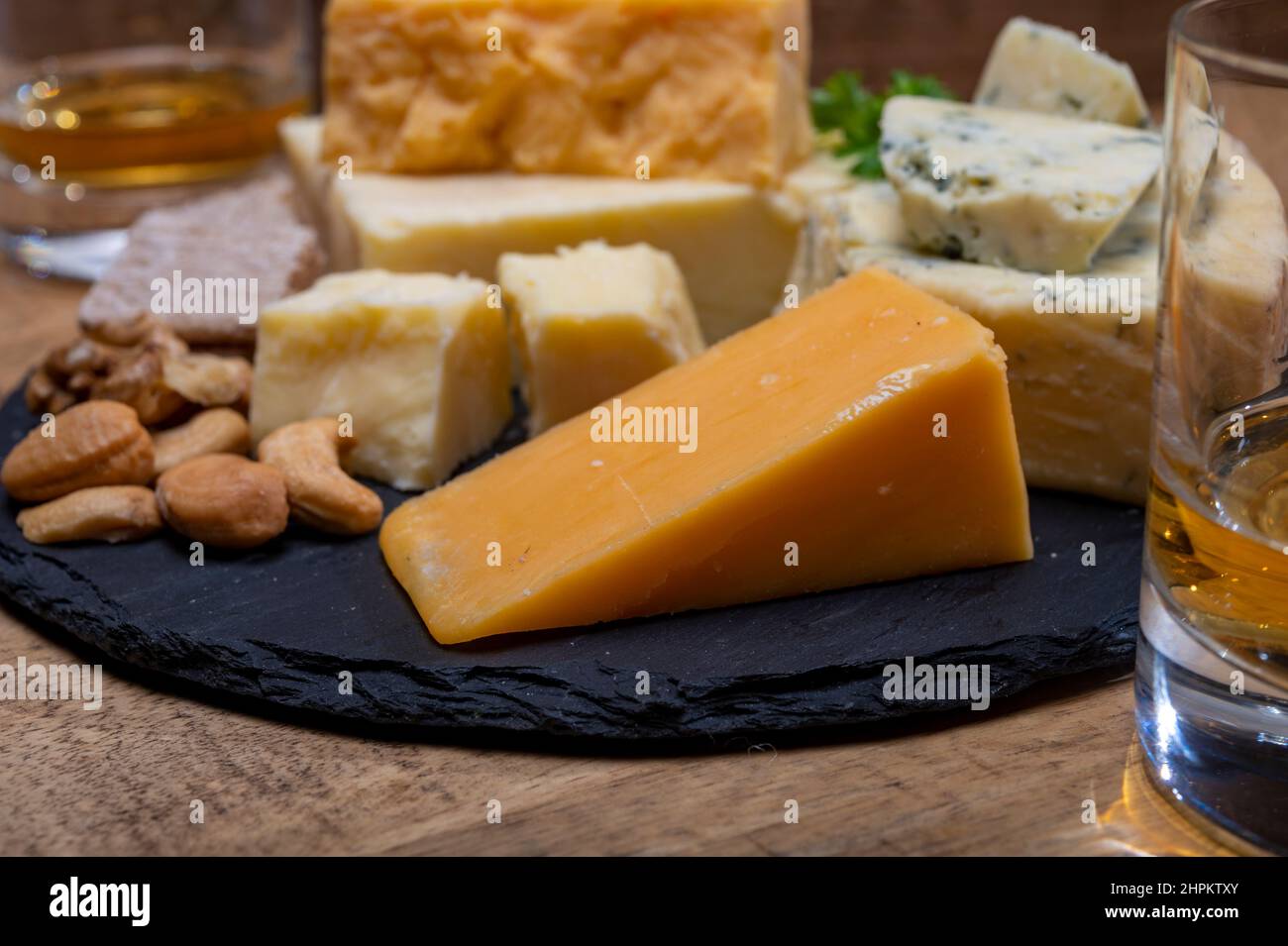 British drinks and food pairing, glasses of Scotch whisky and cheeses ...