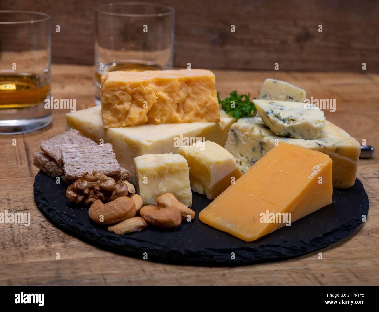 British drinks and food pairing, glasses of Scotch whisky and cheeses ...