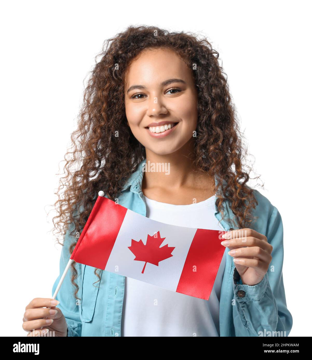 Beautiful young African-American woman with Canadian flag on white ...