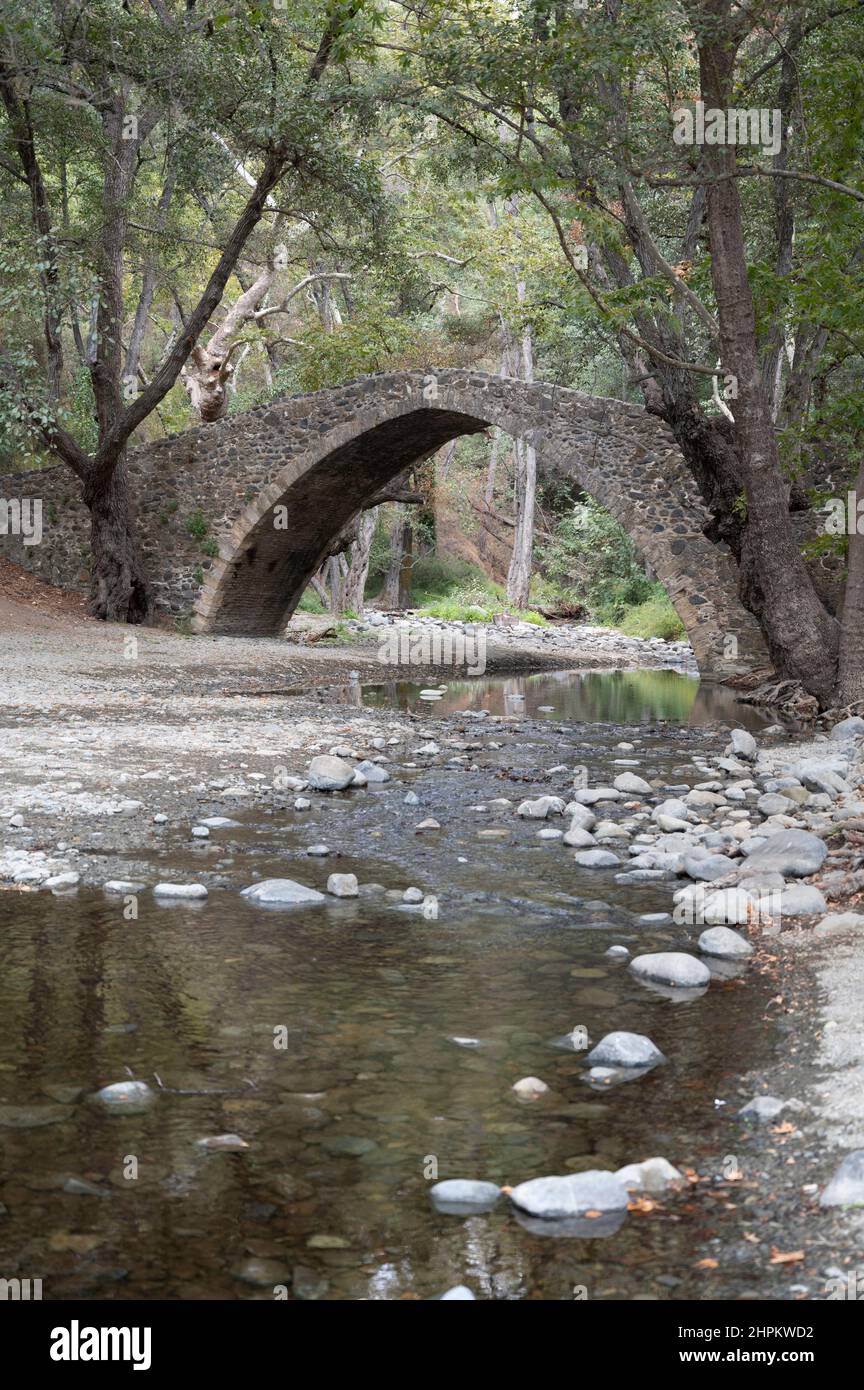 Medieval venetian stone arch bridge located in green Troodos mountains ...