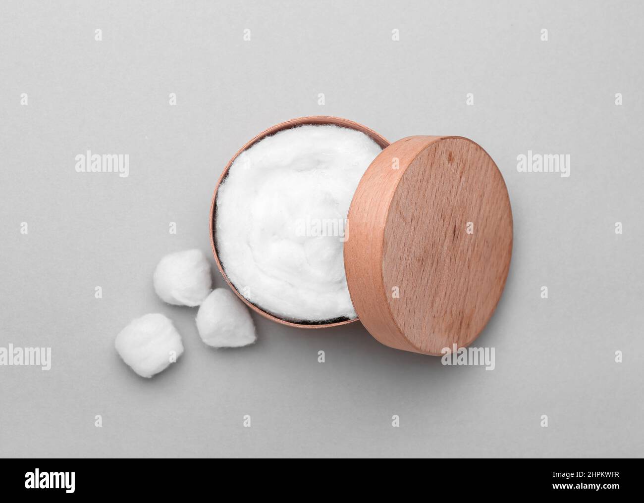 Wooden box with soft cotton wool on light background Stock Photo - Alamy