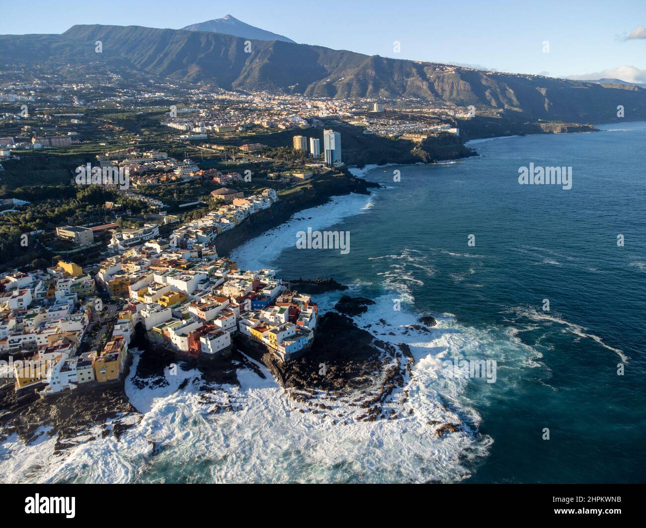 Aerial view on colorful houses and top of mount Teide in Puerto de la ...