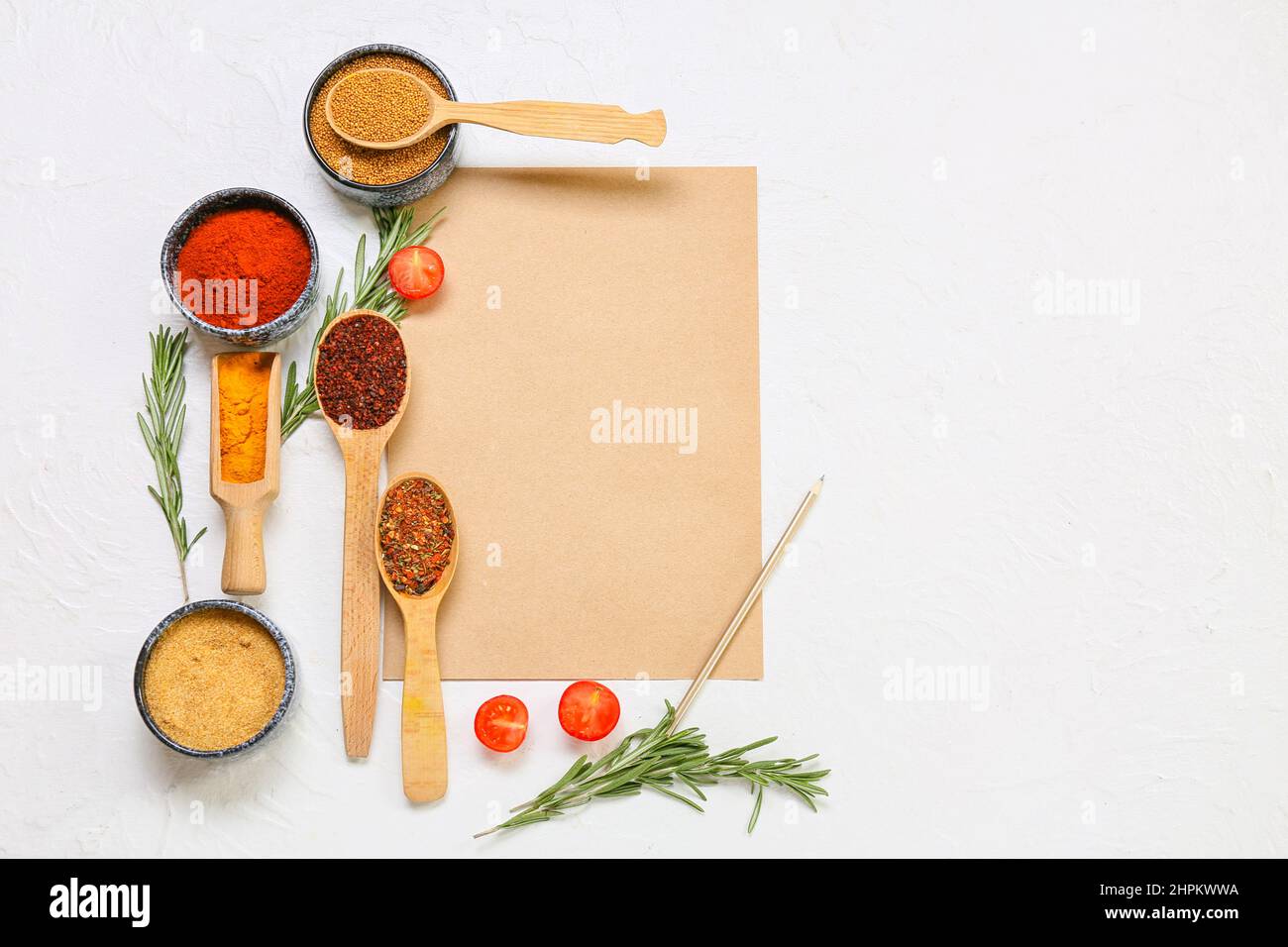 Composition with blank sheet of paper and spices on light background ...