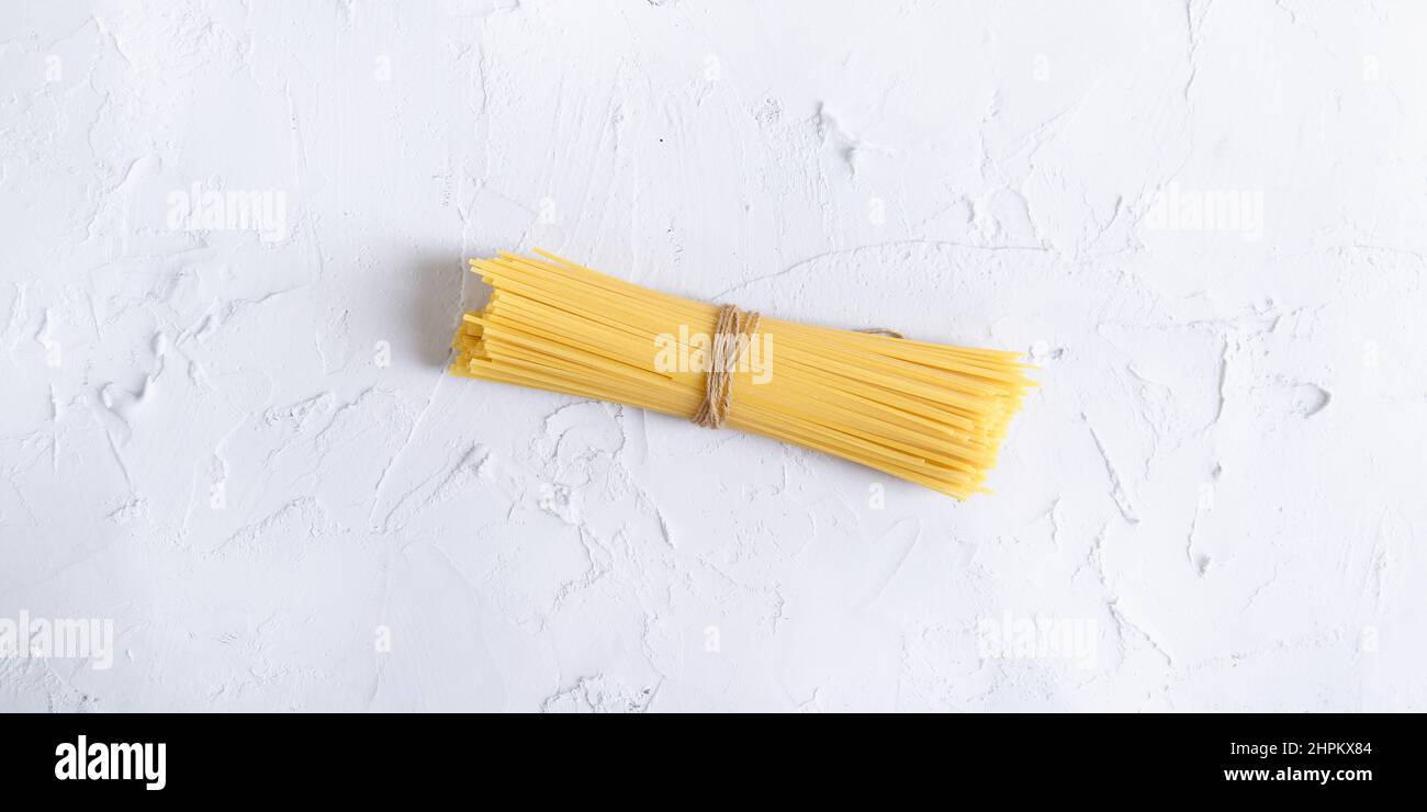 A series of typical italian pasta Linguine, uncooked, on white ...
