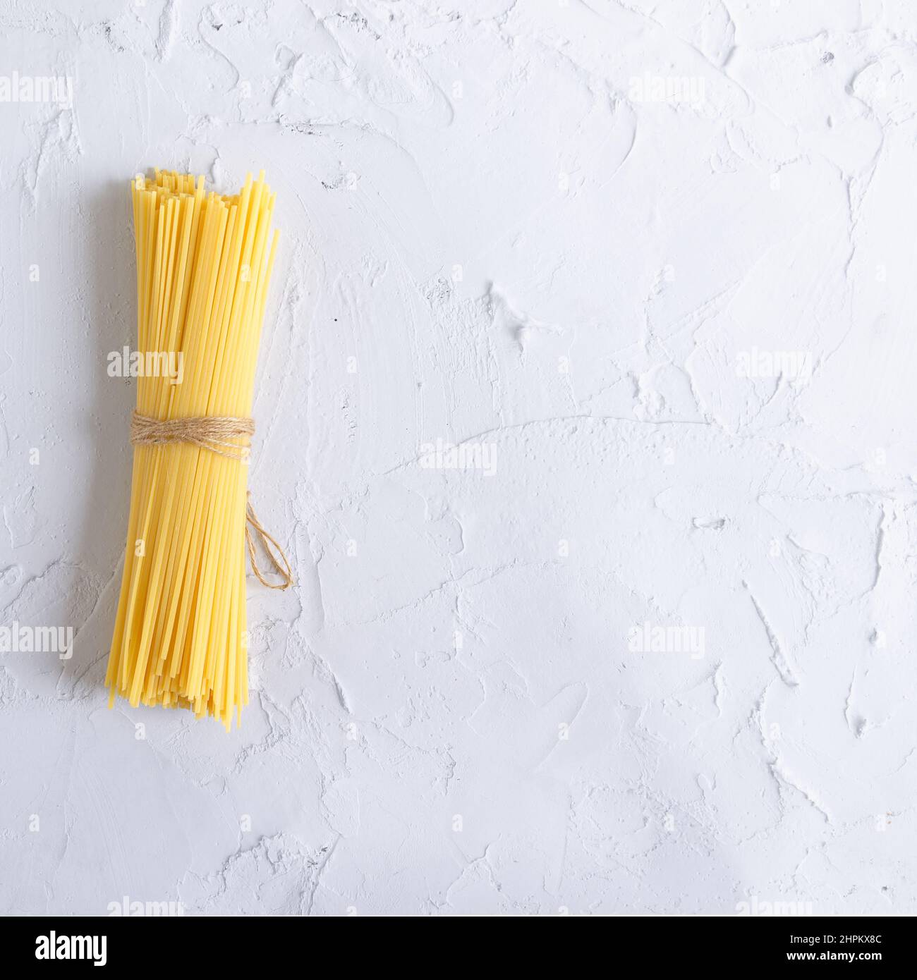 A series of typical italian pasta Linguine, uncooked, on white ...
