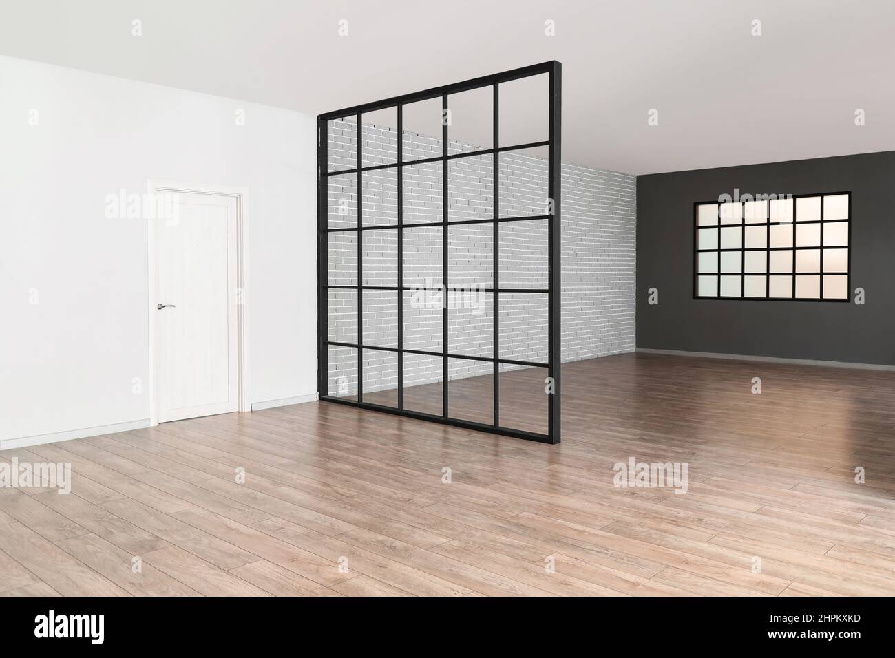 View of big empty room with black folding screen and window Stock Photo ...