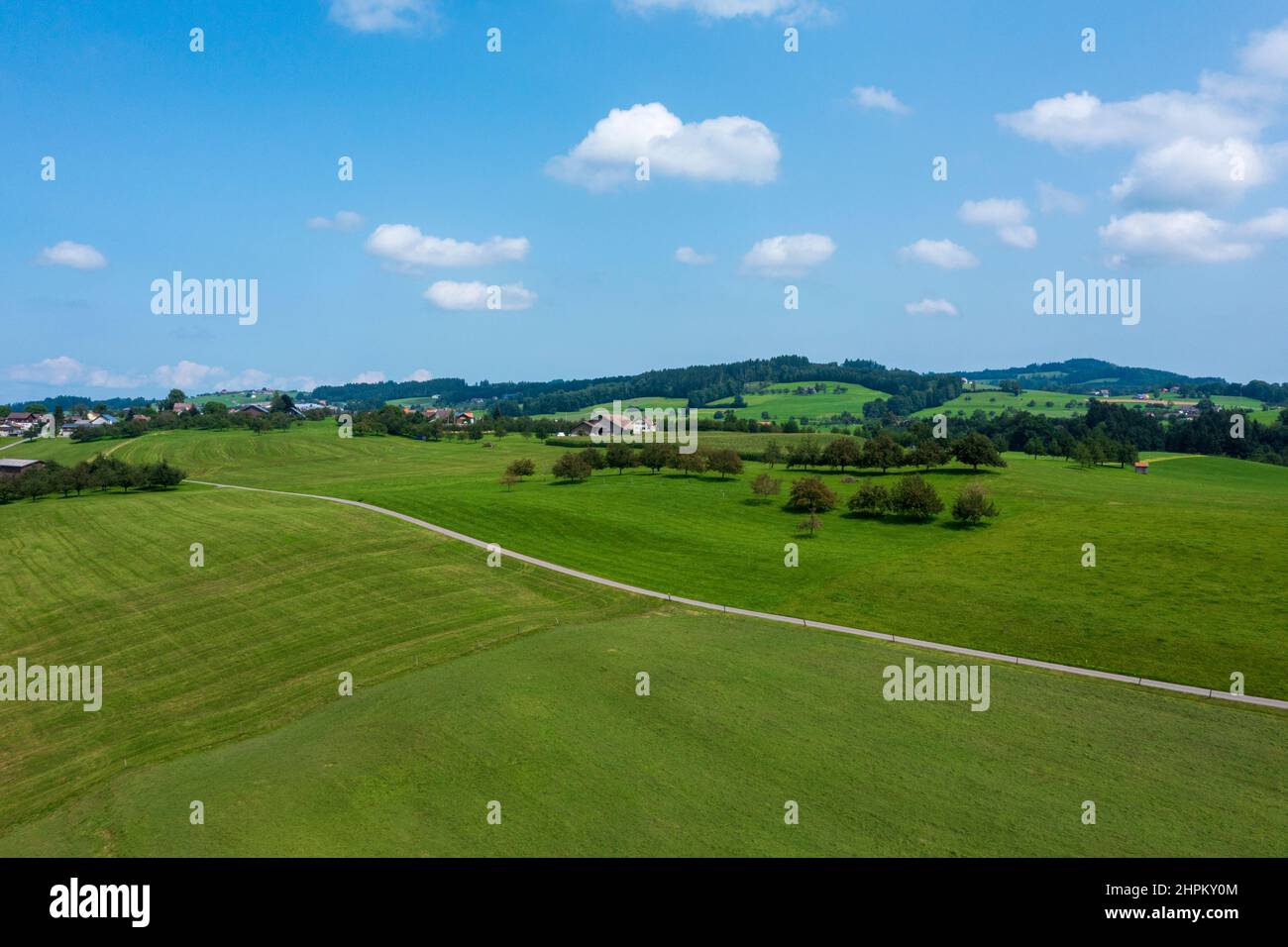 Panorama aerial view of the green Swiss hills on a summers day with ...