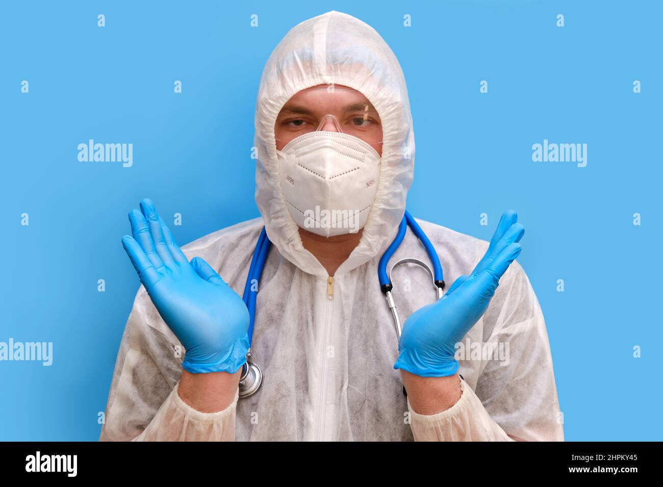 Man doctor medic in a protective suit uniform with goggles and face ...