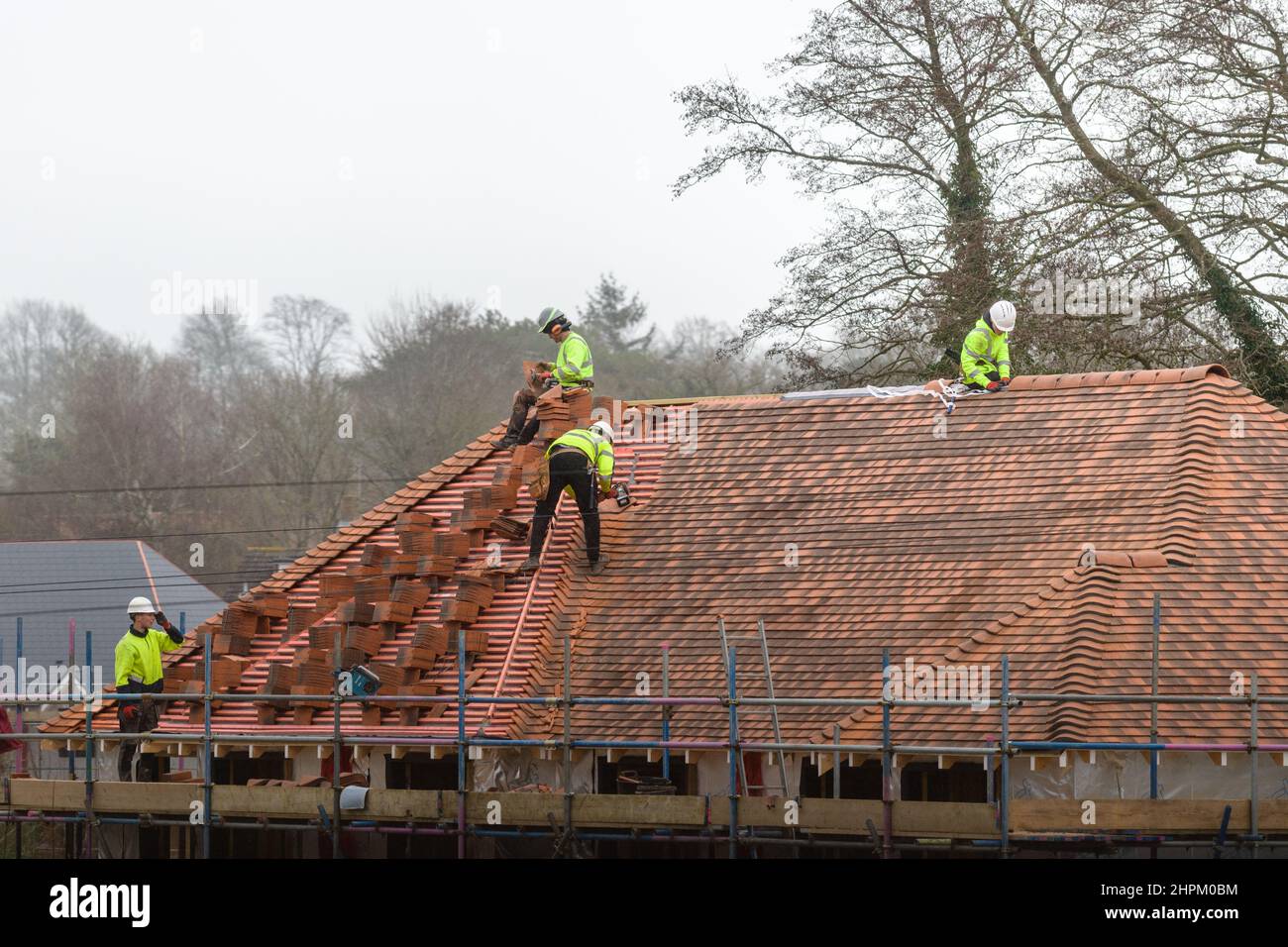 Working on roof Stock Photo - Alamy