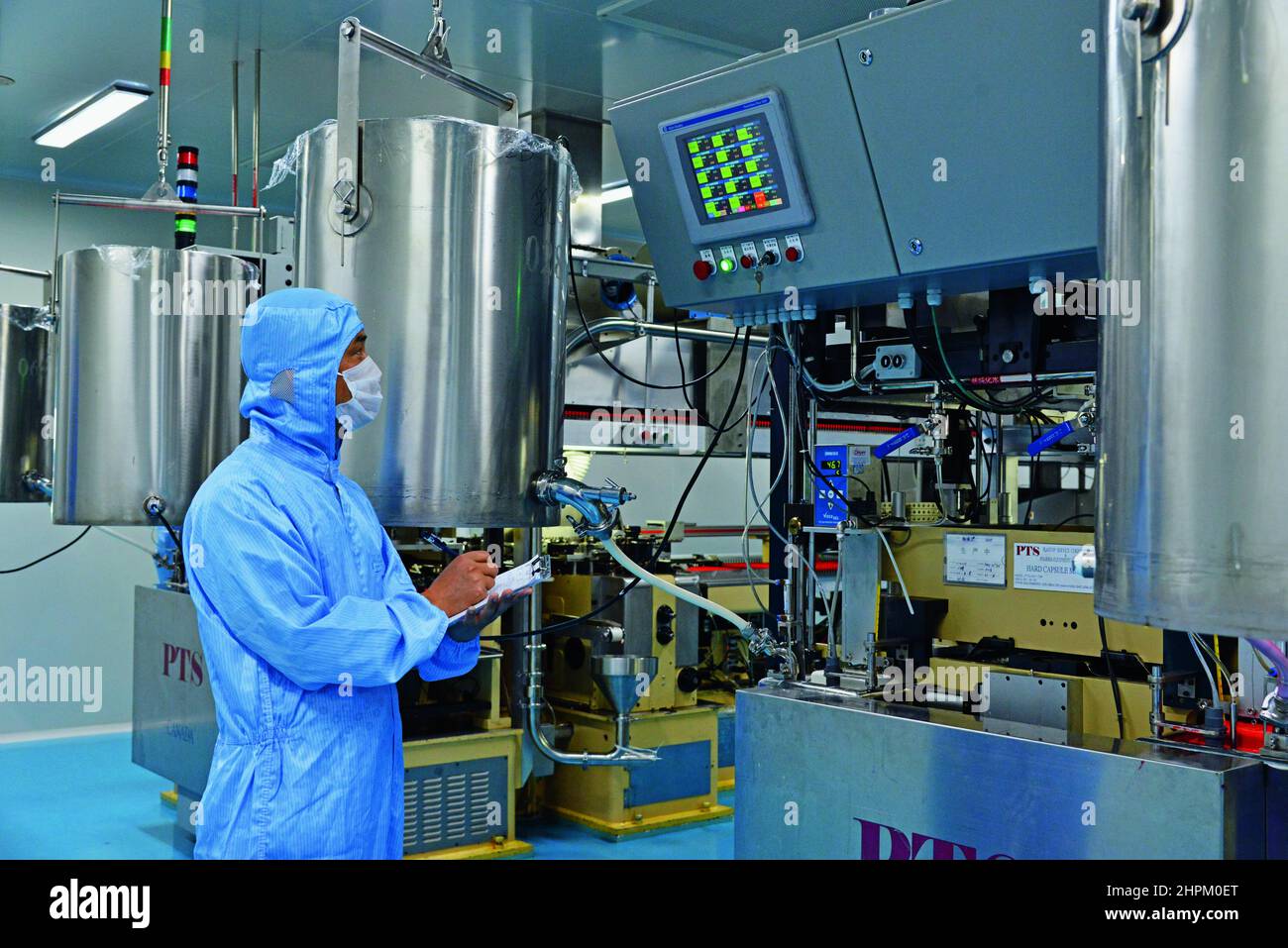 Medicinal capsule production workshop Stock Photo - Alamy