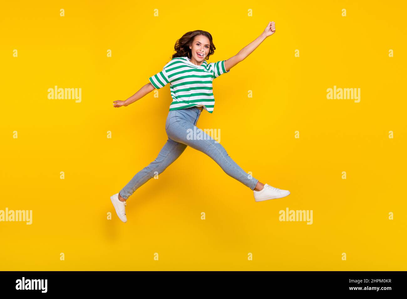 Full length profile side photo of young excited girl have fun walk ...